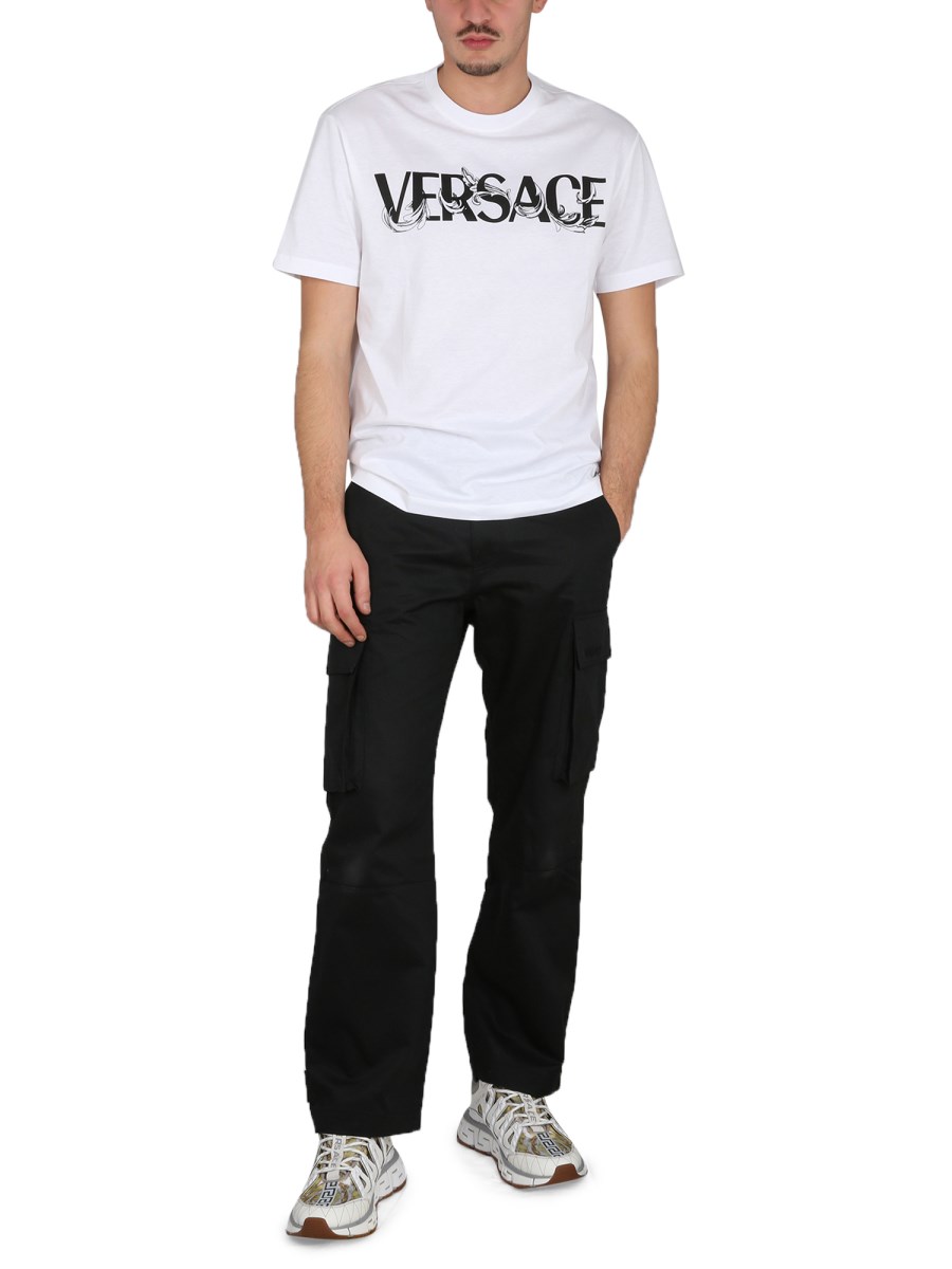 VERSACE - COTTON JERSEY BAROQUE LOGO T-SHIRT - Eleonora Bonucci