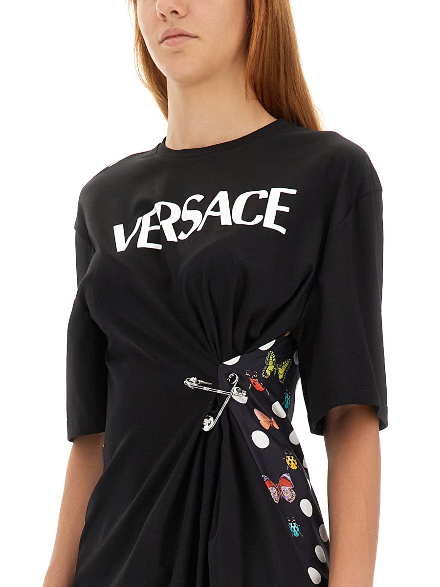 VERSACE - T-SHIRT WITH BUTTERFLIES AND SAFETY PIN LOGO VERSACE - T-SHIRT WITH BUTTERFLIES AND SAFETY PIN LOGO